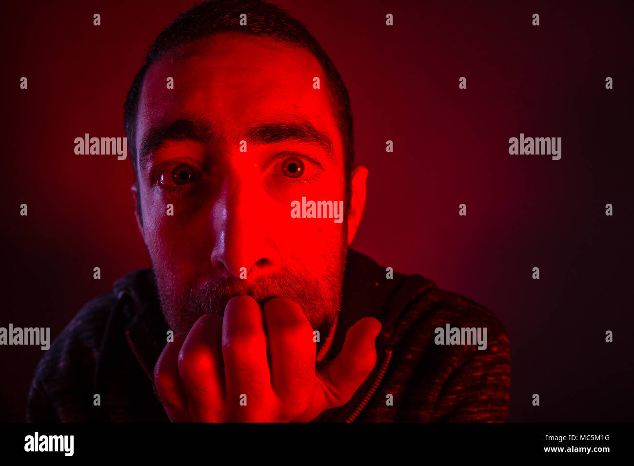 Stunned frightened man with surprised facial expression. Close up ...