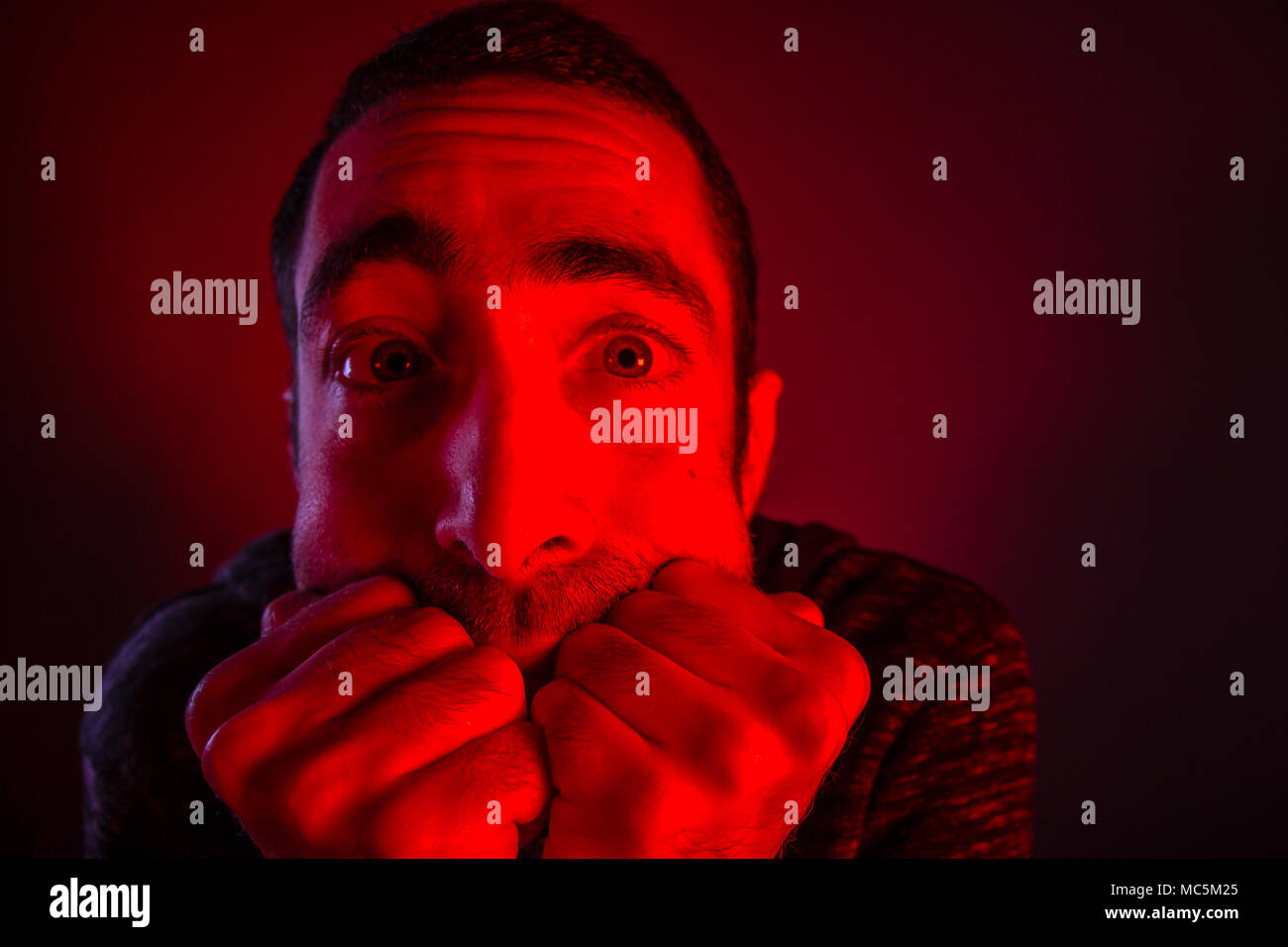 Stunned frightened man with surprised facial expression. Close up ...