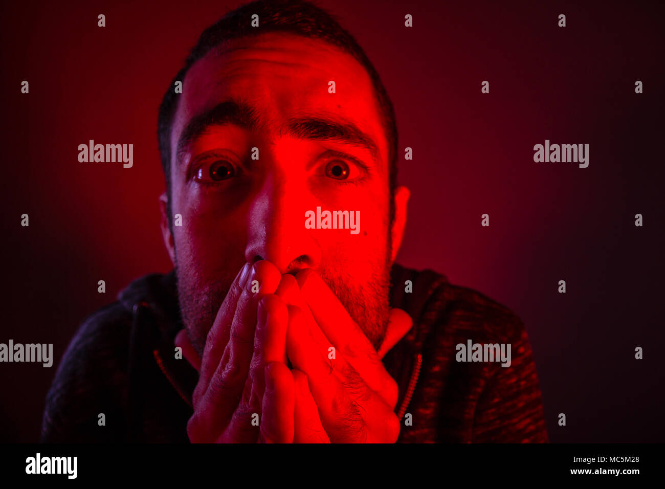 Stunned frightened man with surprised facial expression. Close up ...