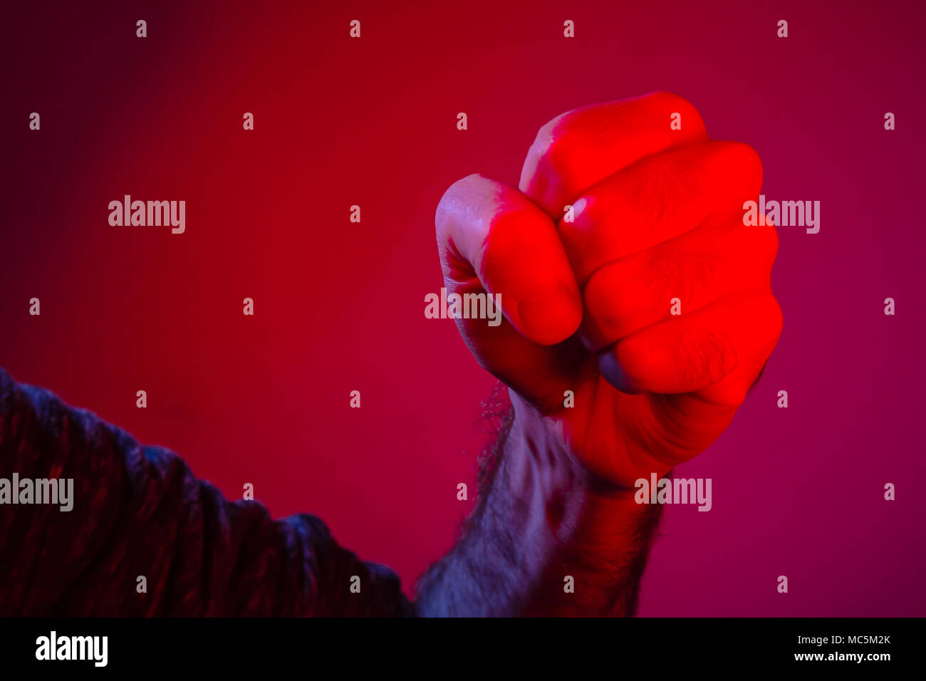 Closeup on man fists clenched in anger Stock Photo - Alamy