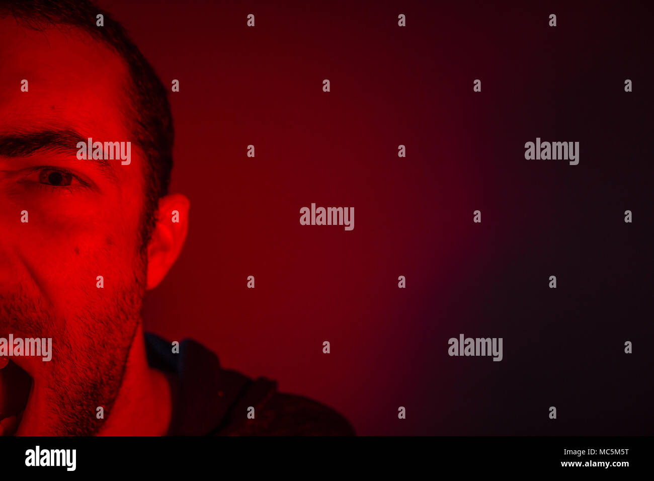 Man with angry facial expression screaming out loud. Close up portrait ...