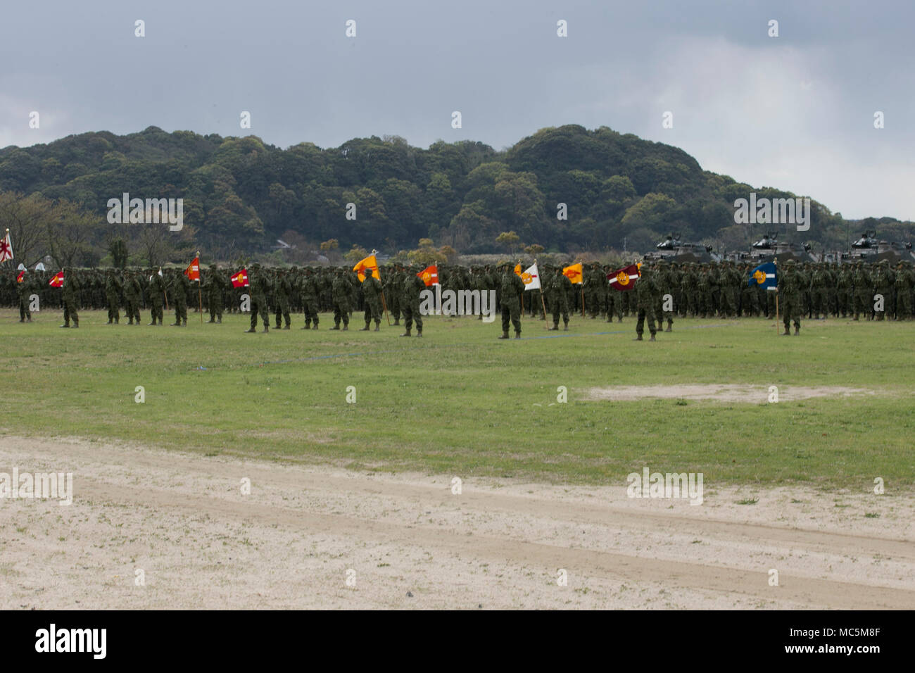 Service members with the Japan Ground Self-Defense Force stand in ...