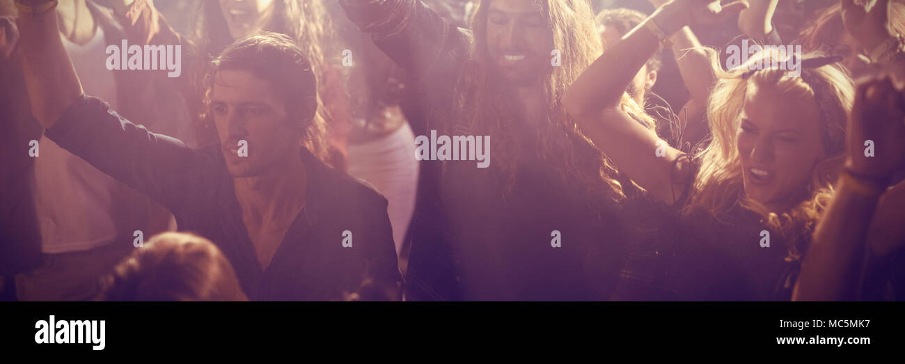 Crowd dancing at nightclub Stock Photo - Alamy