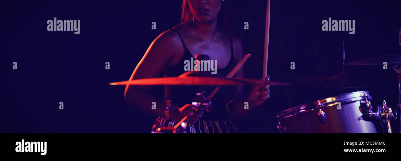Drummer sitting at drum kit hi-res stock photography and images - Alamy