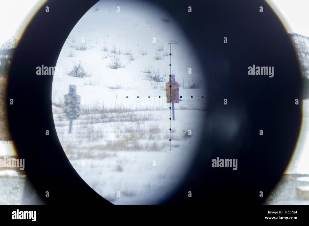 Long-distance targets are seen through a spotting scope as paratroopers ...