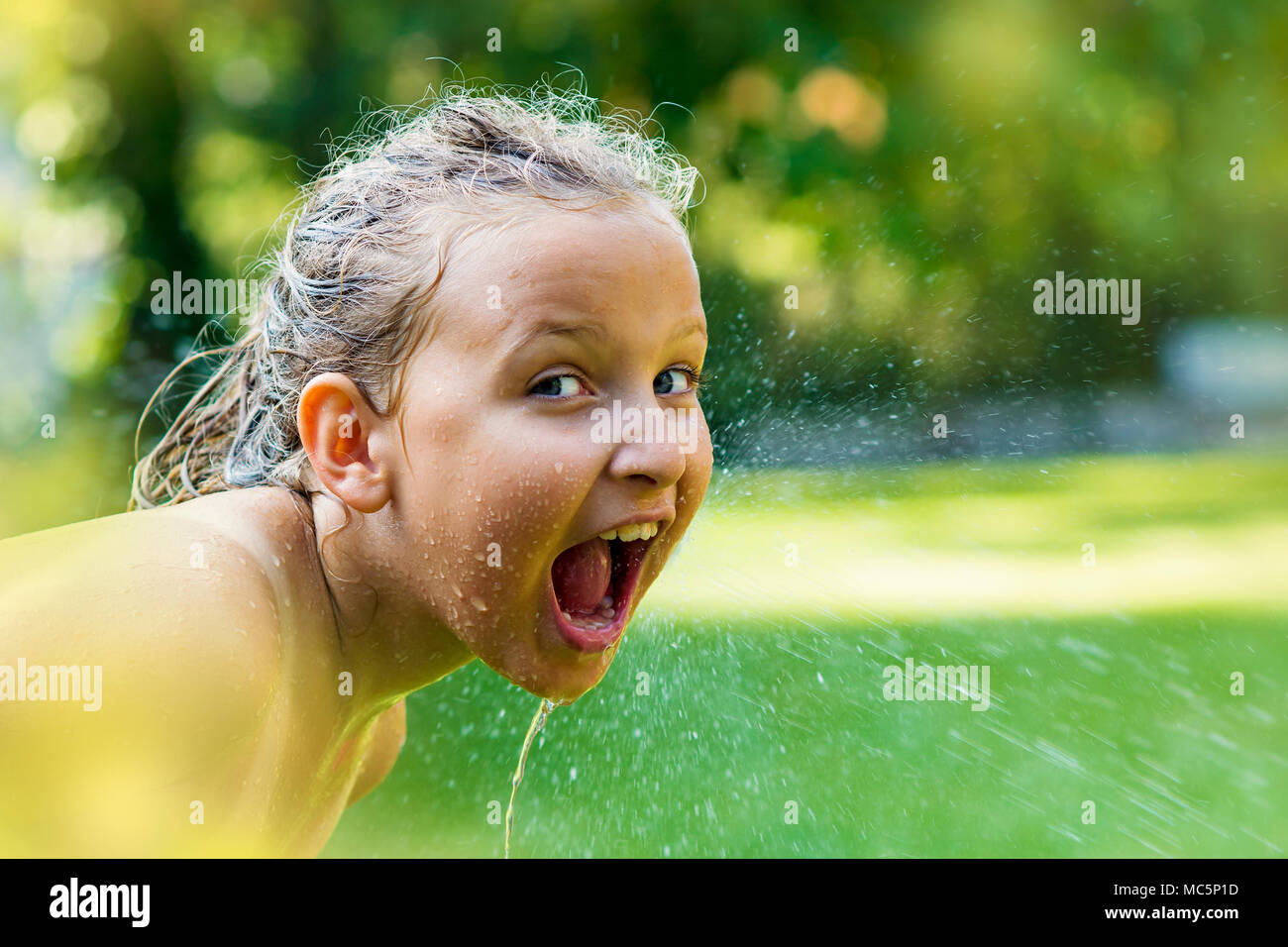 Girl drinking water fountain hi-res stock photography and images - Alamy