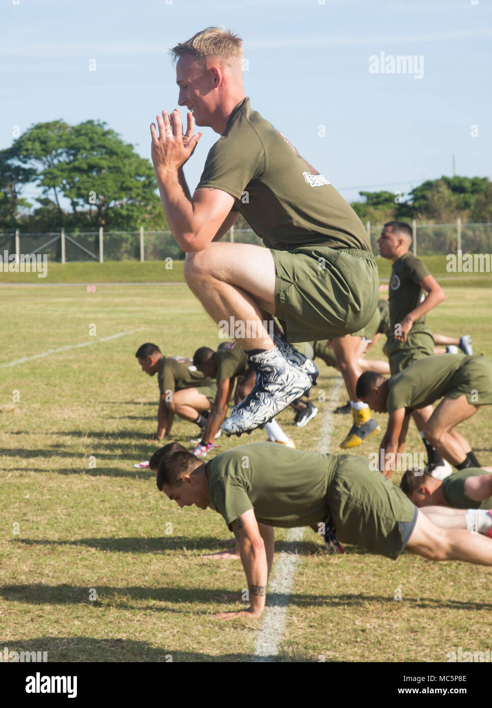 3rd Marine Logistics Group Marines and Sailors warm up before their ...