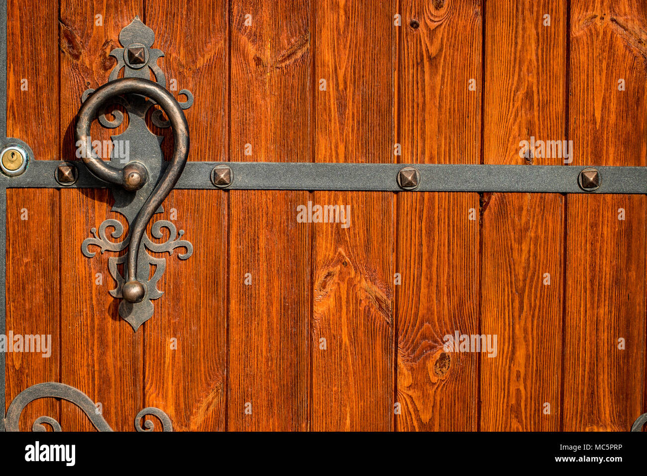 wooden gate with wrought iron elements close up Stock Photo - Alamy