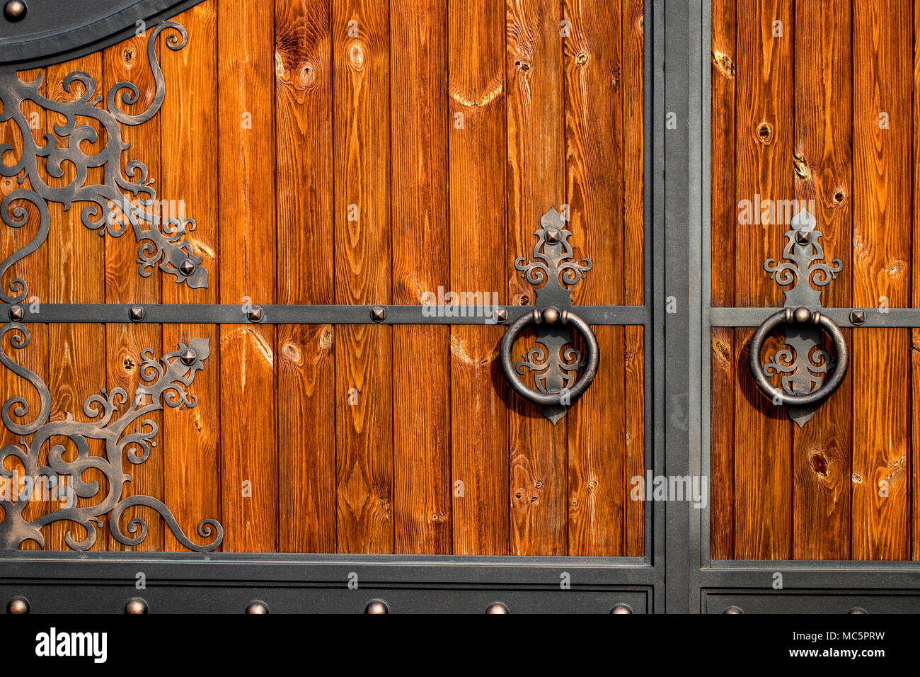 wooden gate with wrought iron elements close up Stock Photo - Alamy