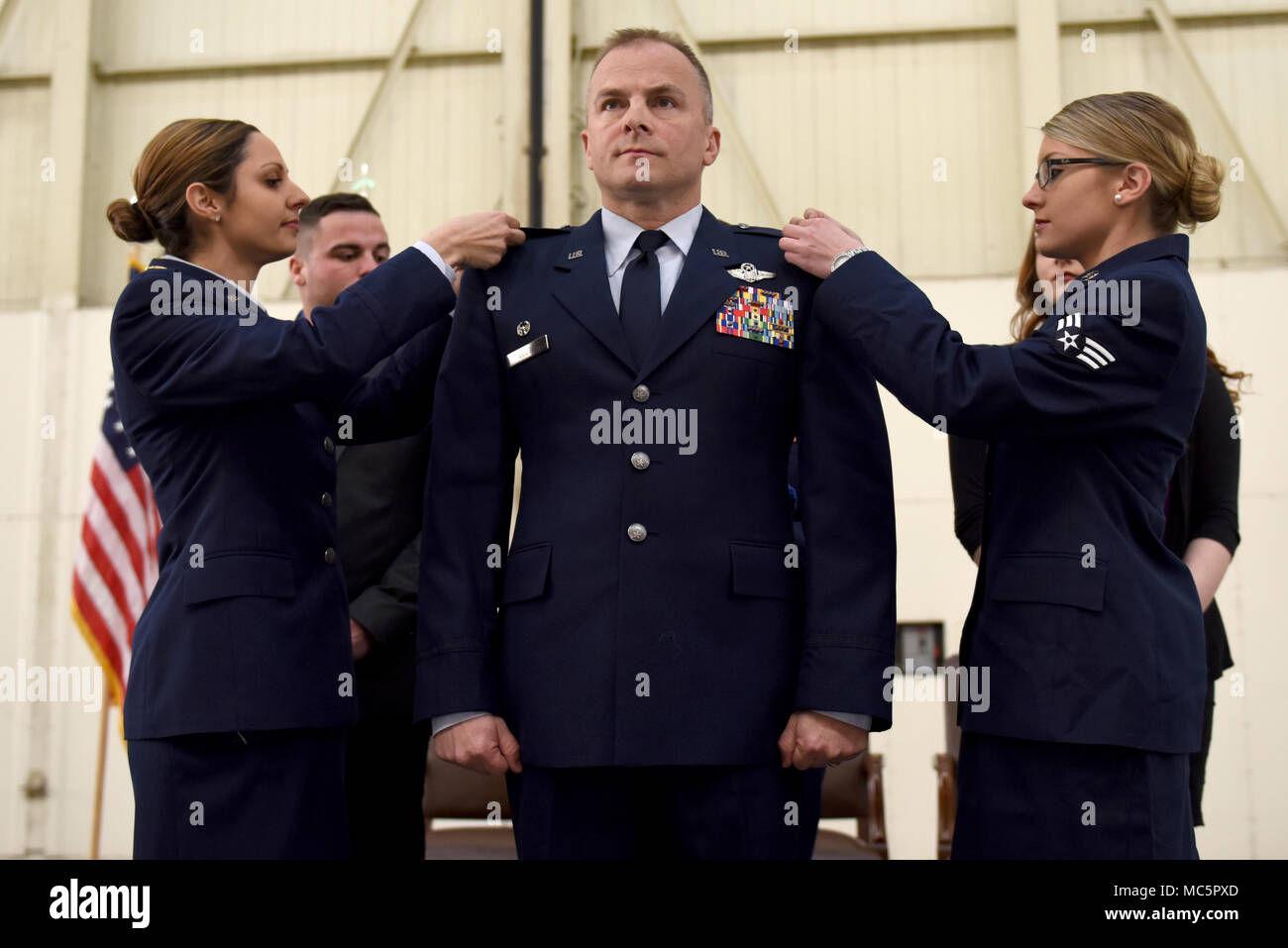 U.S. Air Force Lt. Col. Gary Dodge (middle) is pinned to the rank of ...