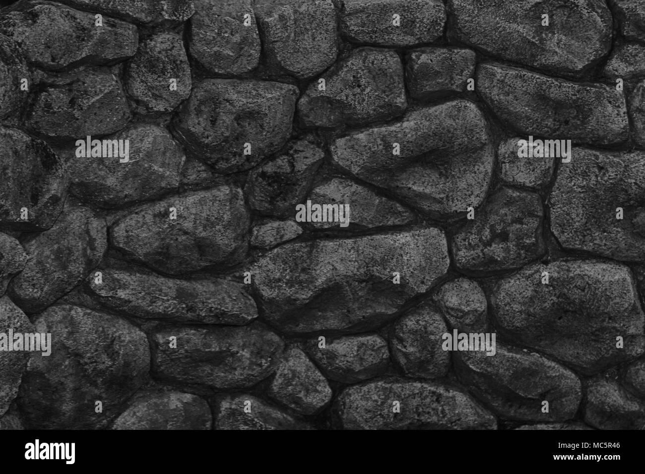 Monochrome Stone wall for background or rocks rough texture Stock Photo ...