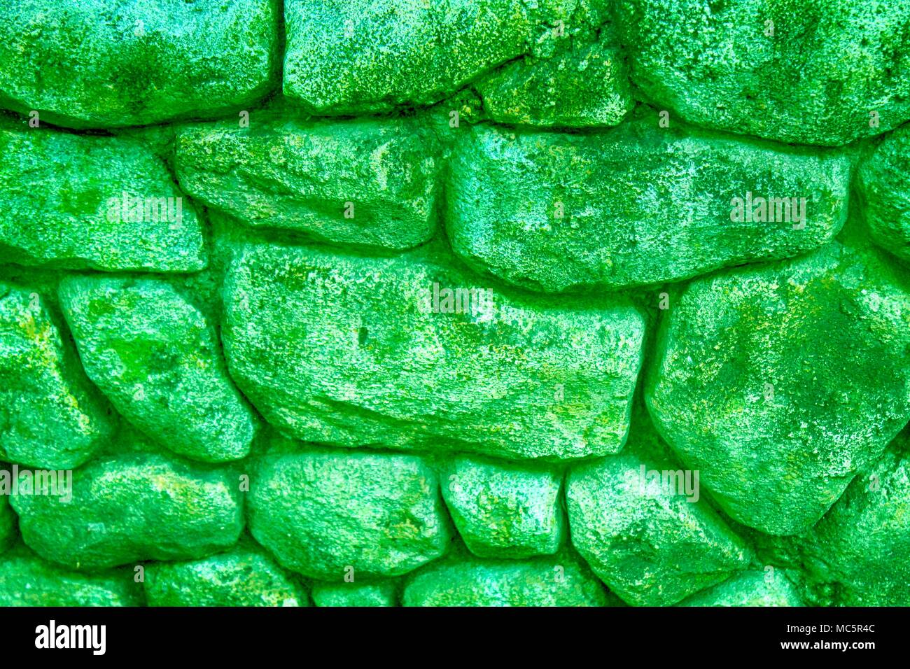 Green Stone wall for background or rocks rough texture Stock Photo - Alamy