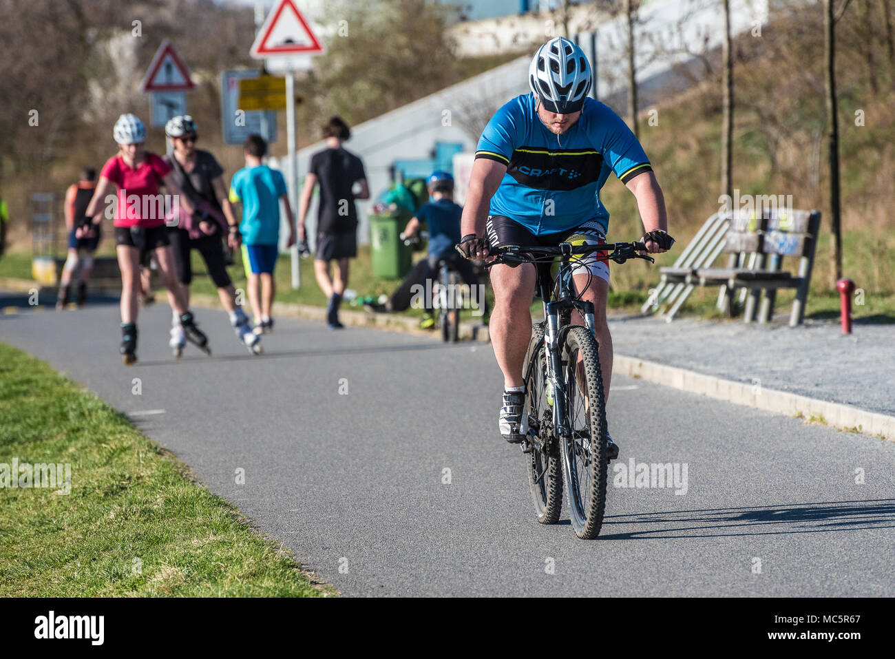 Roller skating and cycling Stock Photo - Alamy