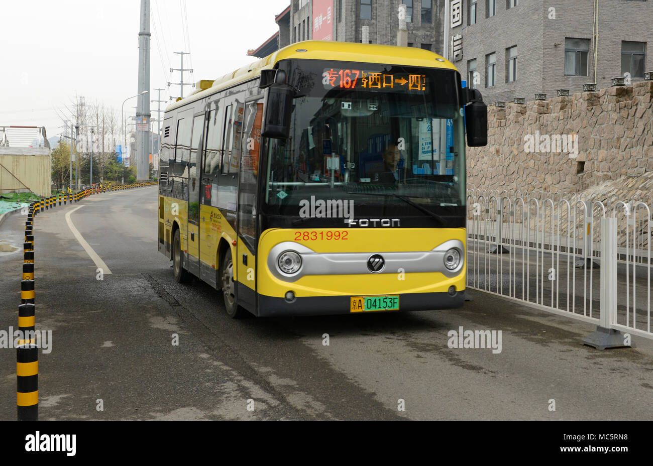 A bus passes under a bridge next to the Tonghui river in eastern ...