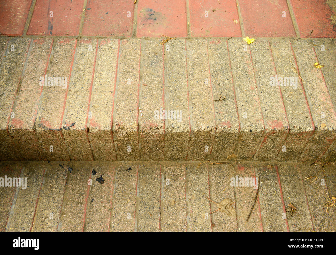 Bricks with only coloured tops and bottoms placed endways to form steps ...
