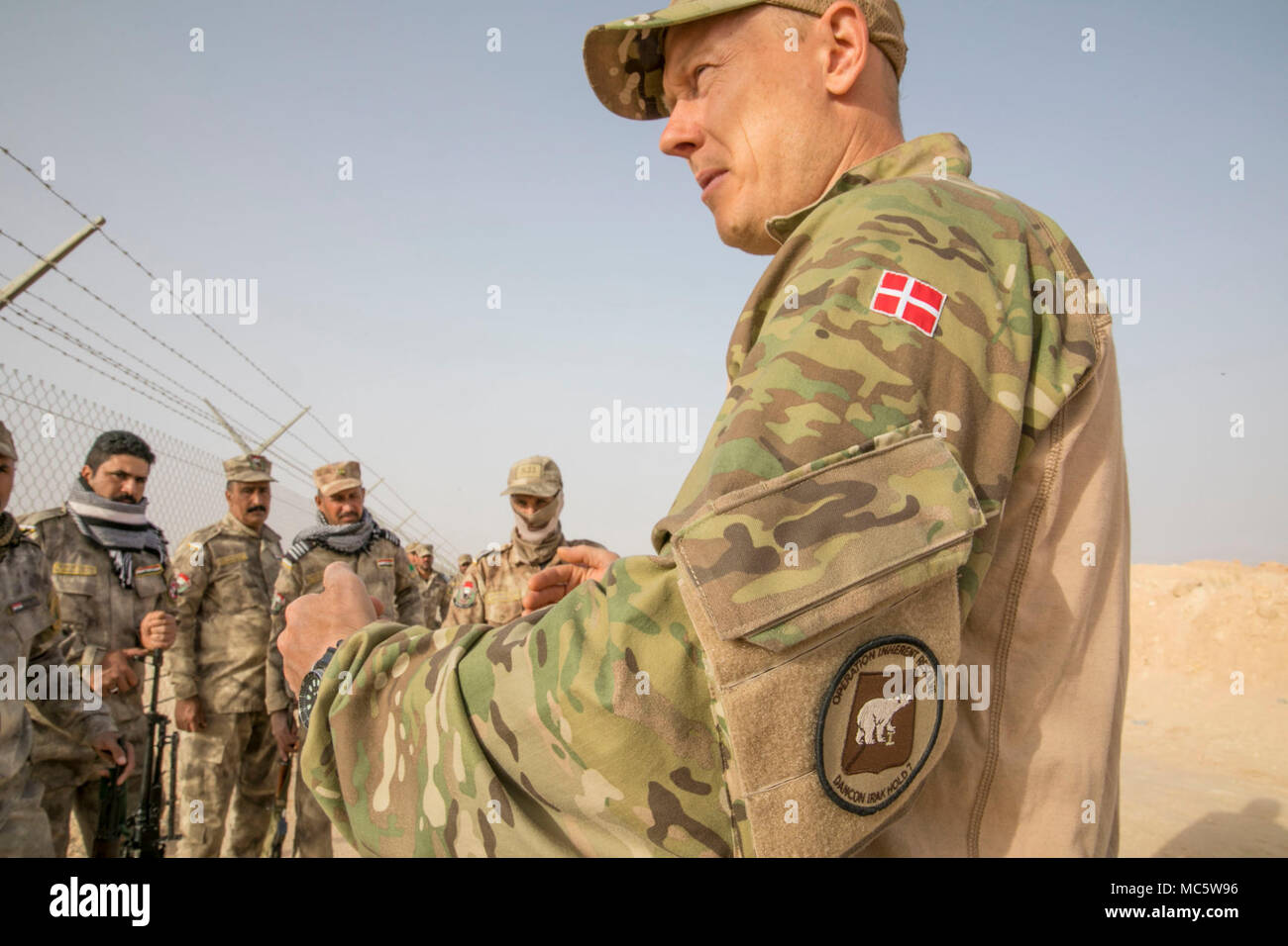 Danish 1st Lt. Marc briefs Iraqi border guard force members on how to ...