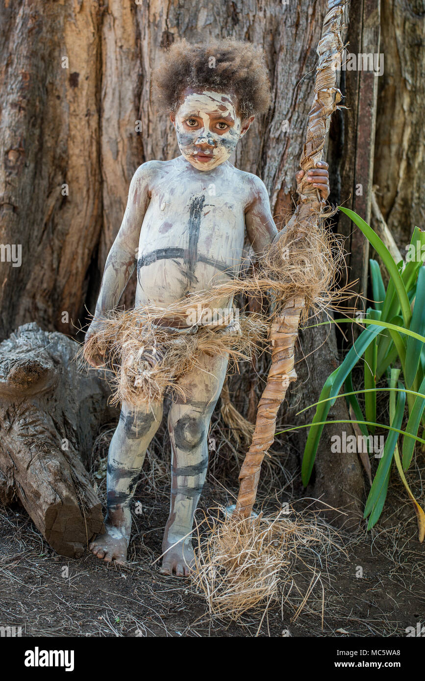 Portrait of a young boy with face and body painting after a "moko moko ...