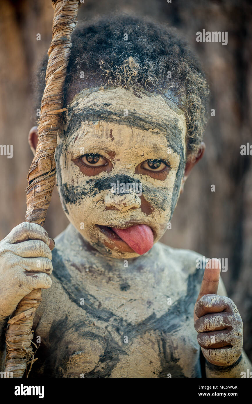 Portrait of a young boy with face and body painting after a "moko moko ...