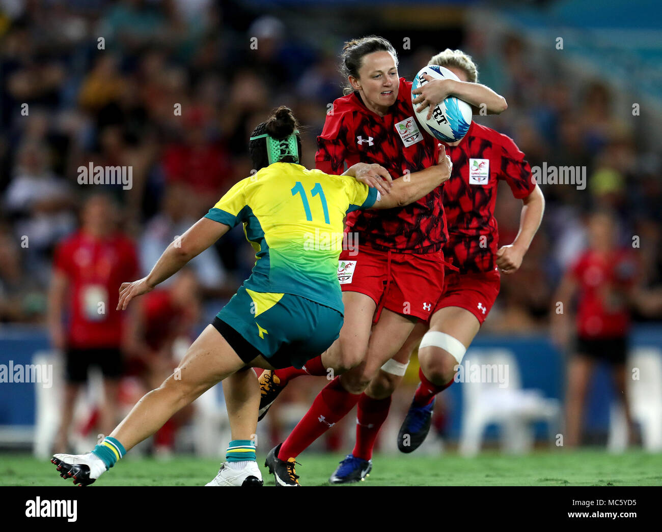 Wales' Laurie Harries (right) is tackled by Australia's Emilee Cherry ...