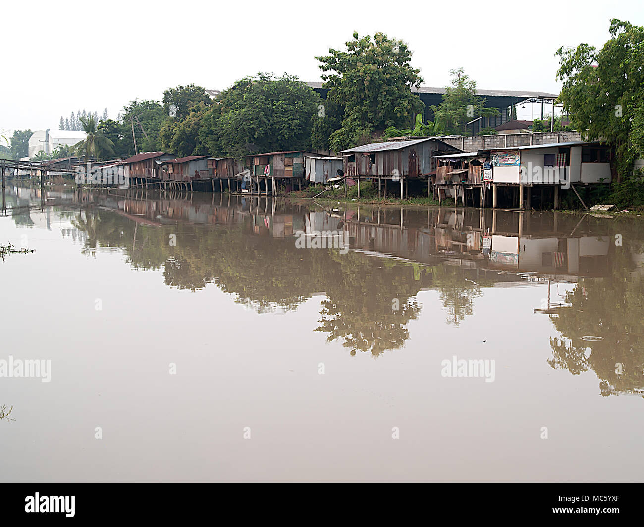Home waterfront slums , Old houses along the river Stock Photo - Alamy