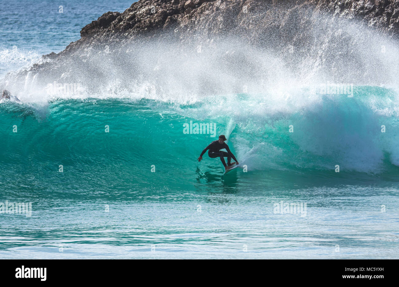 Surfer riding a tube Stock Photo - Alamy