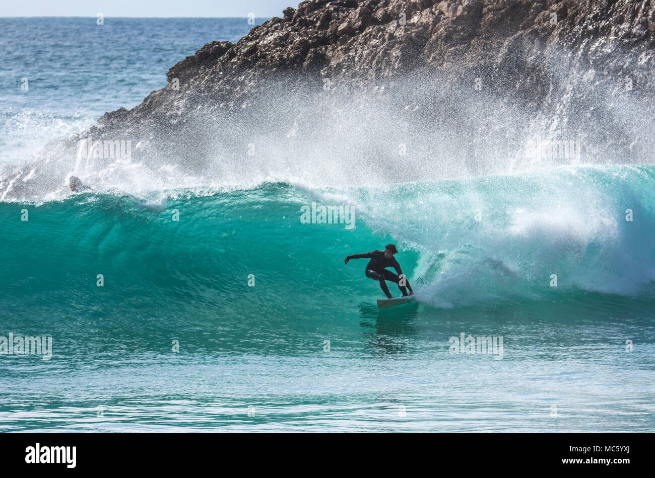 Surfer riding a tube Stock Photo - Alamy
