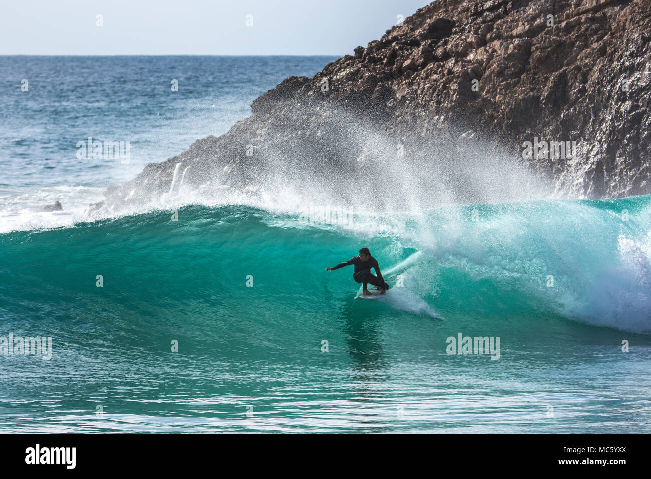 Surfer riding a tube Stock Photo - Alamy