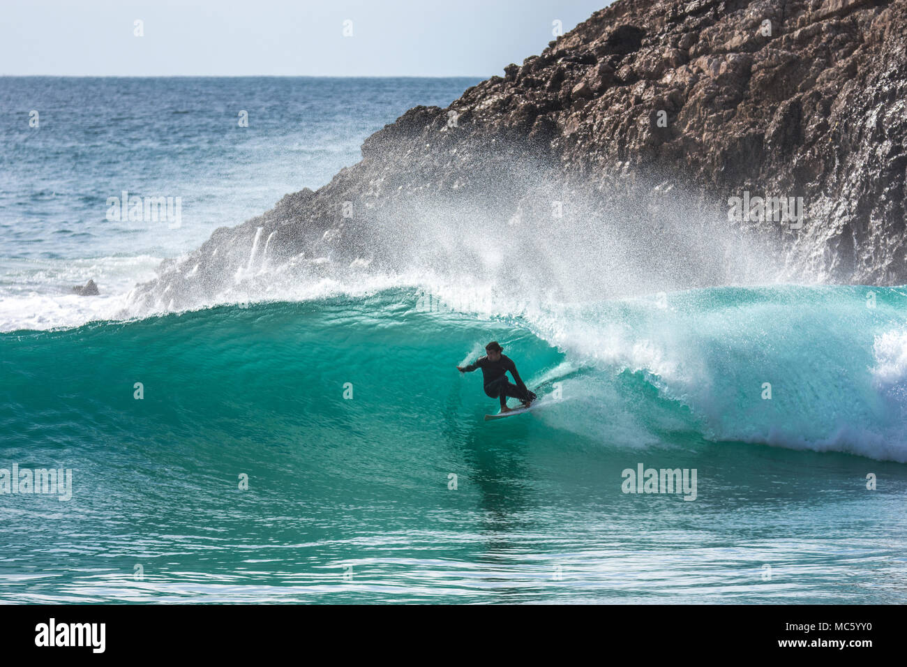 Surfer riding a tube Stock Photo - Alamy