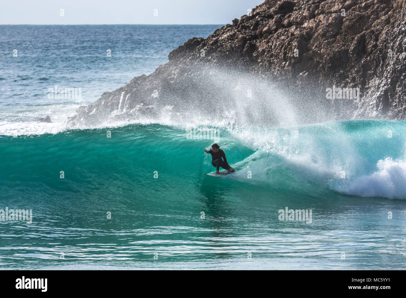 Surfer riding a tube Stock Photo - Alamy
