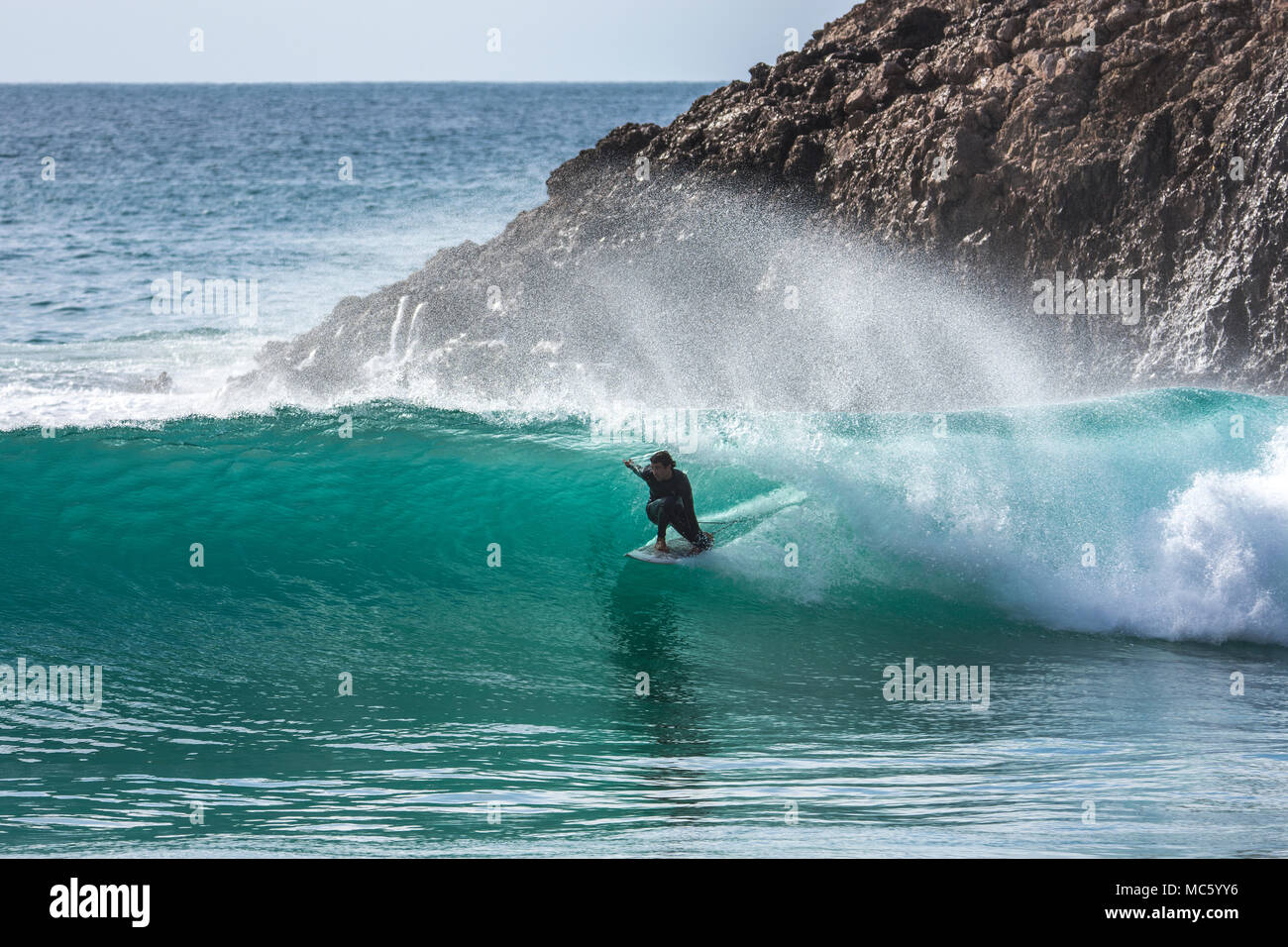 Surfer riding a tube Stock Photo - Alamy