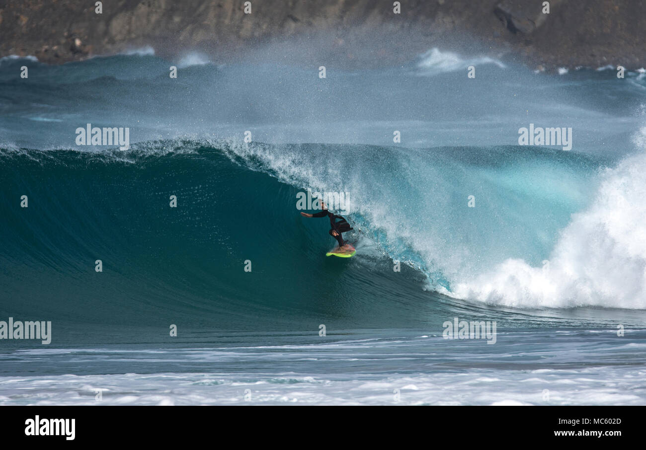Surfer riding a tube Stock Photo - Alamy