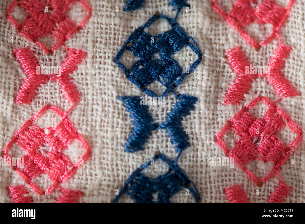 Embroidered pattern on cotton fabric . Fragment. Handmade Stock Photo ...