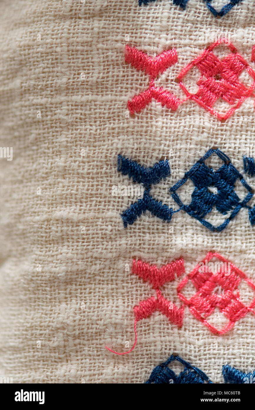 Embroidered pattern on cotton fabric . Fragment. Handmade Stock Photo ...