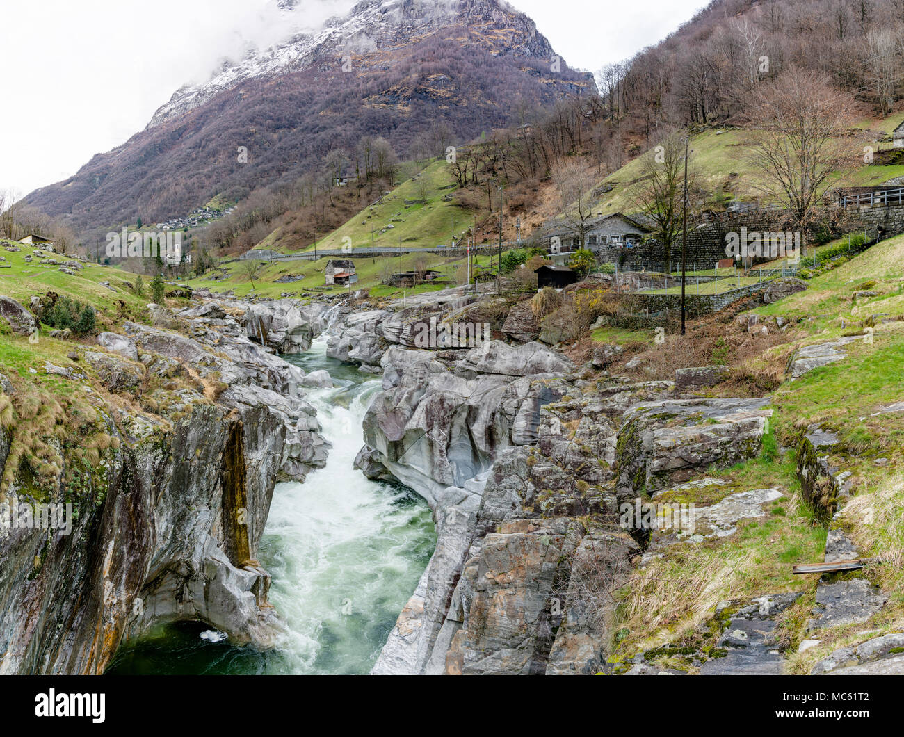 fantastic view of a mountain river carving ist way through a wild rocky ...
