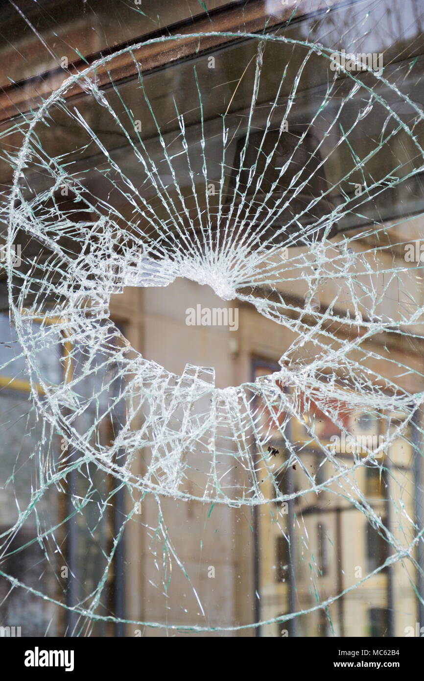 Broken glass hole hi-res stock photography and images - Alamy