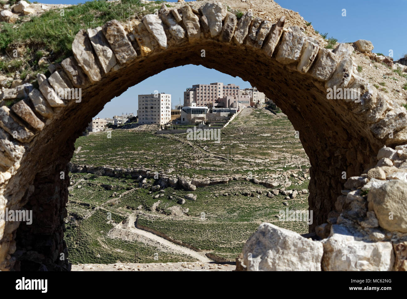 Skyscraper in the suburb of Karak in Jordan, photographed by a wall ...