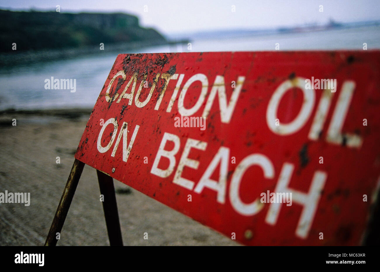 Caution oil on beach sign hi-res stock photography and images - Alamy
