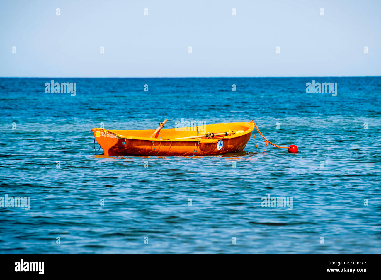 Rescue boat floating in the sea in natural light Stock Photo - Alamy