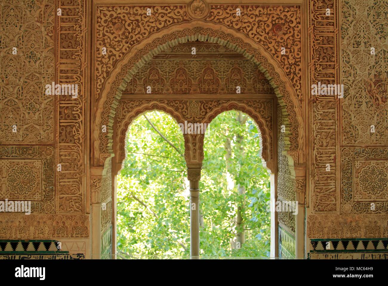 Intricate stone carving details surrounding the horseshoe arched ...