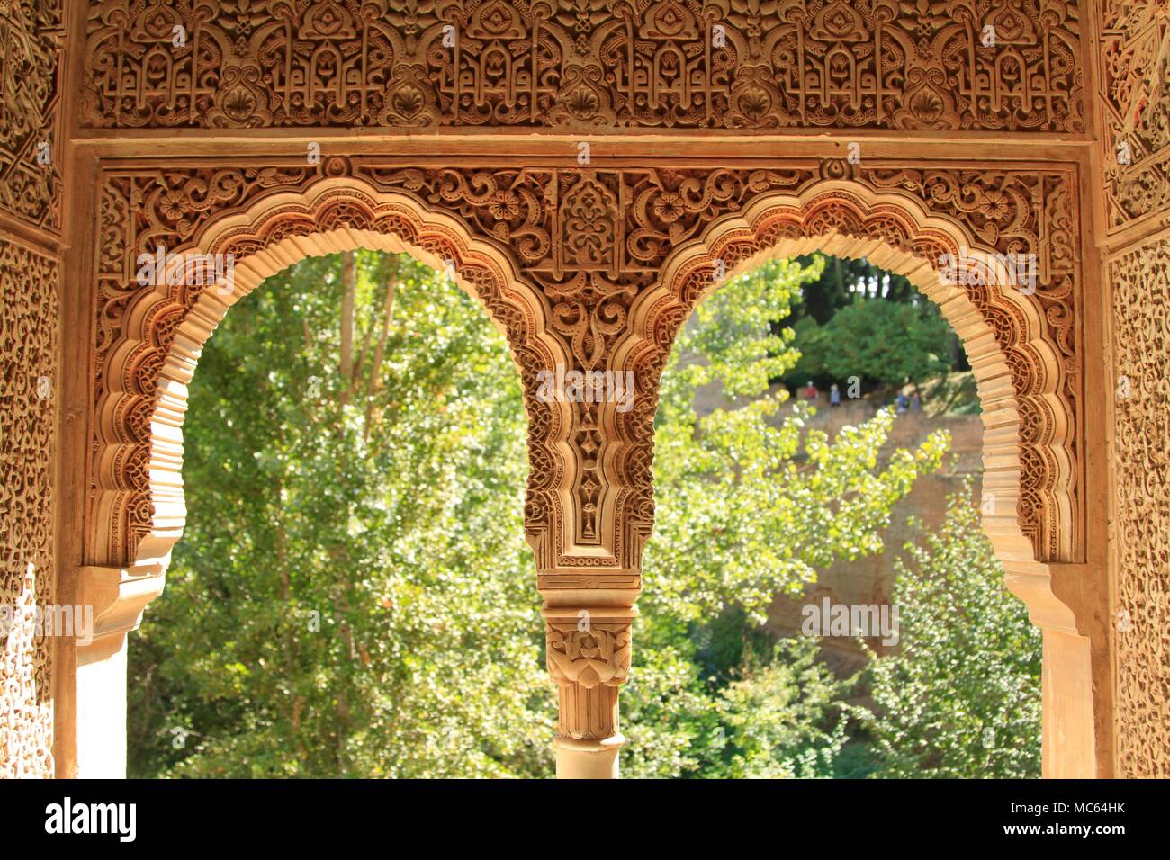 Intricate stone carving details surrounding the horseshoe arched ...