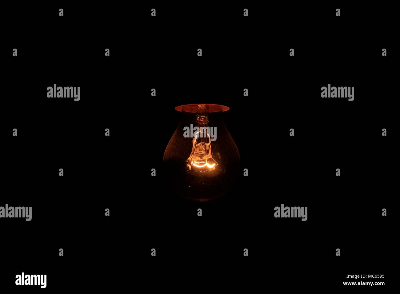 Light bulb in a dark room Stock Photo - Alamy