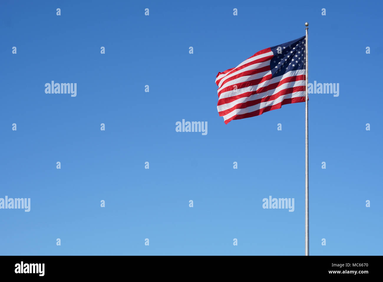 The American flag floats in the air proudly Stock Photo - Alamy