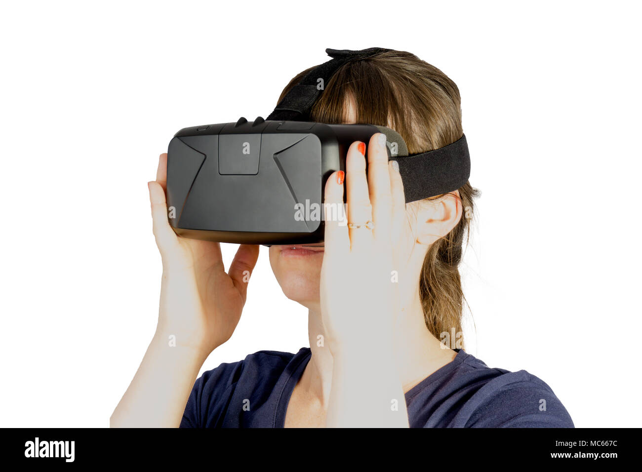 Attractive young woman adjusting her VR headset. Isolated on white ...