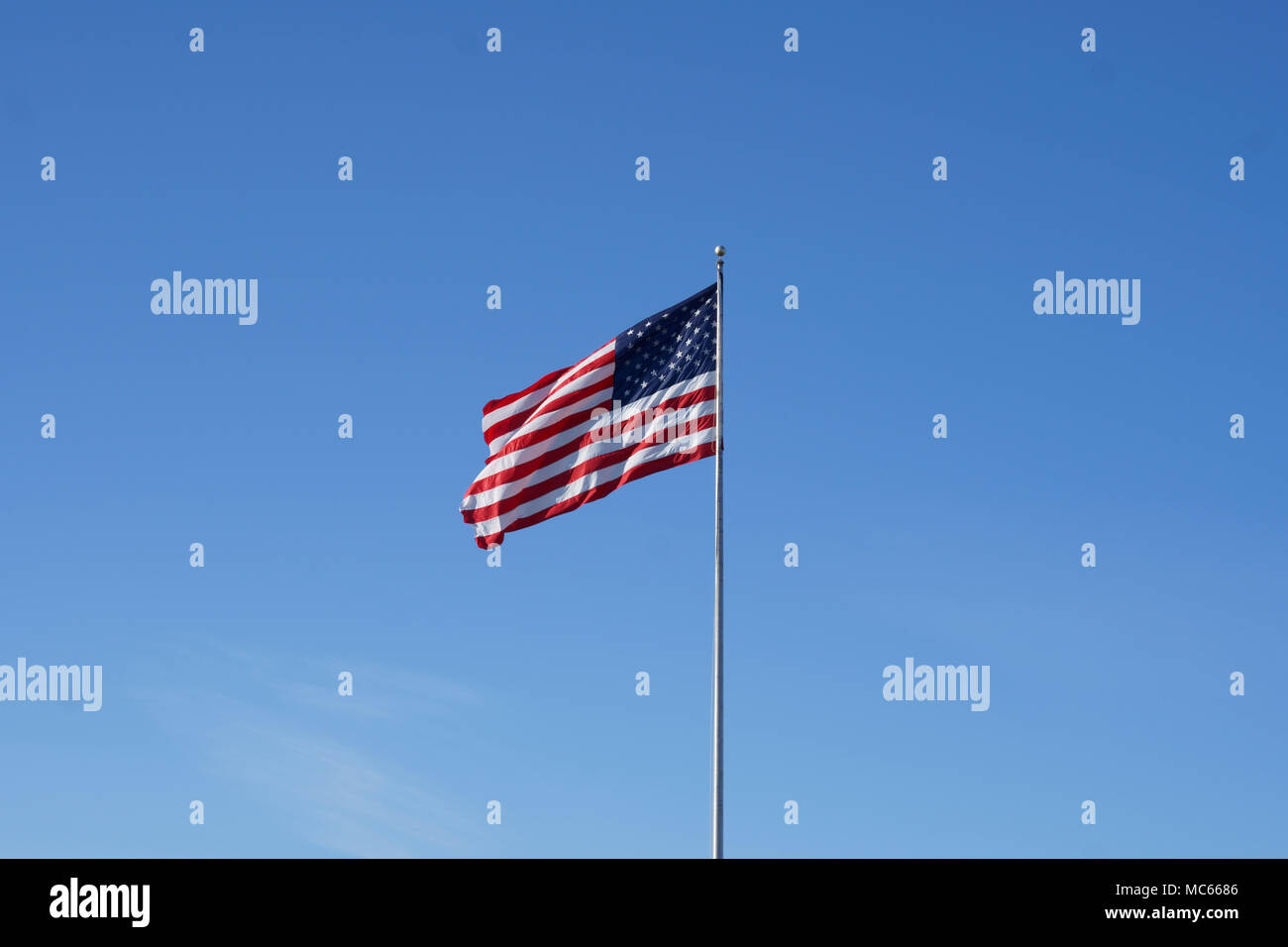 The American flag floats in the air proudly Stock Photo - Alamy