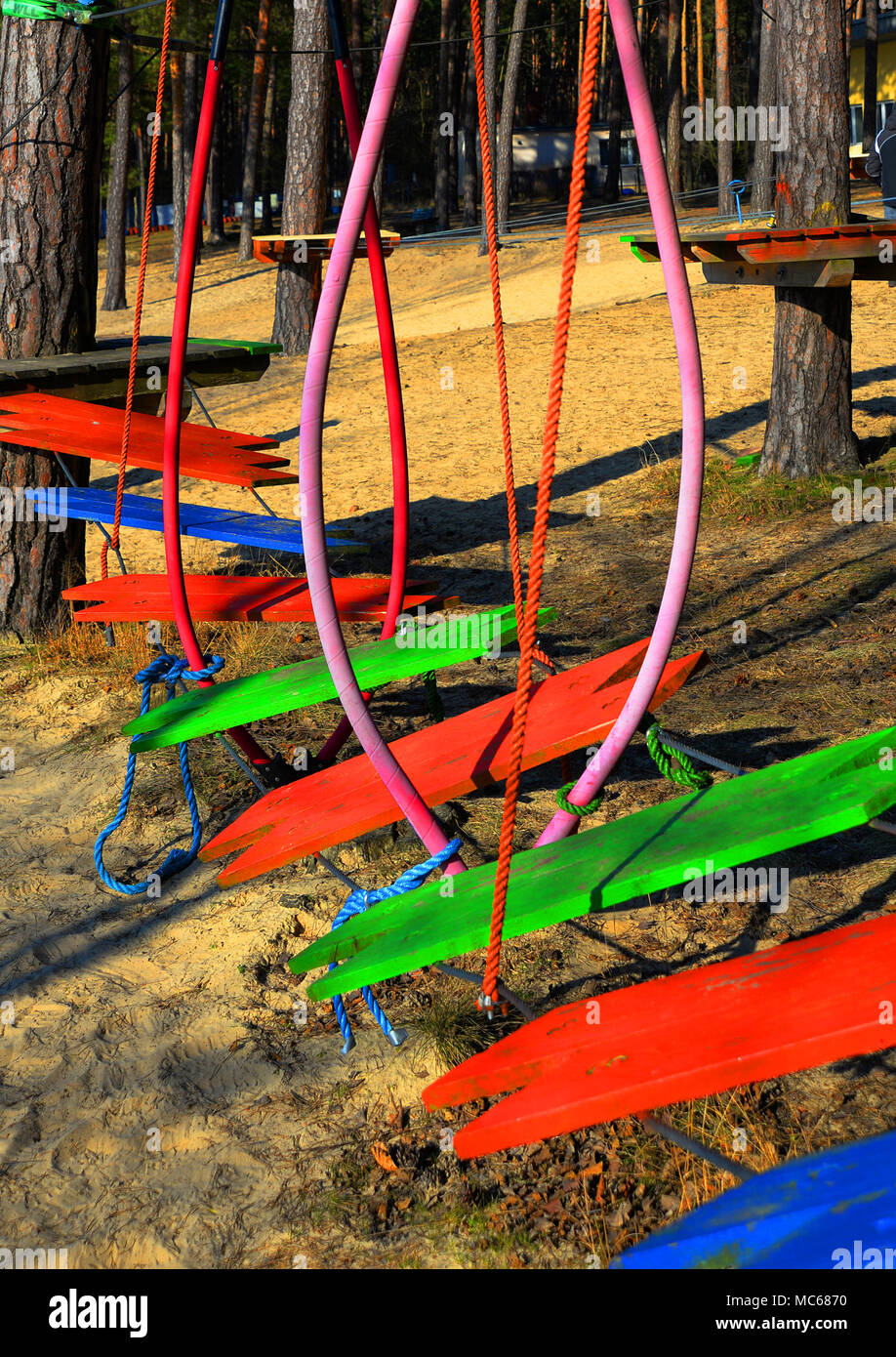 colorful elements of a rope park in the forest Stock Photo - Alamy