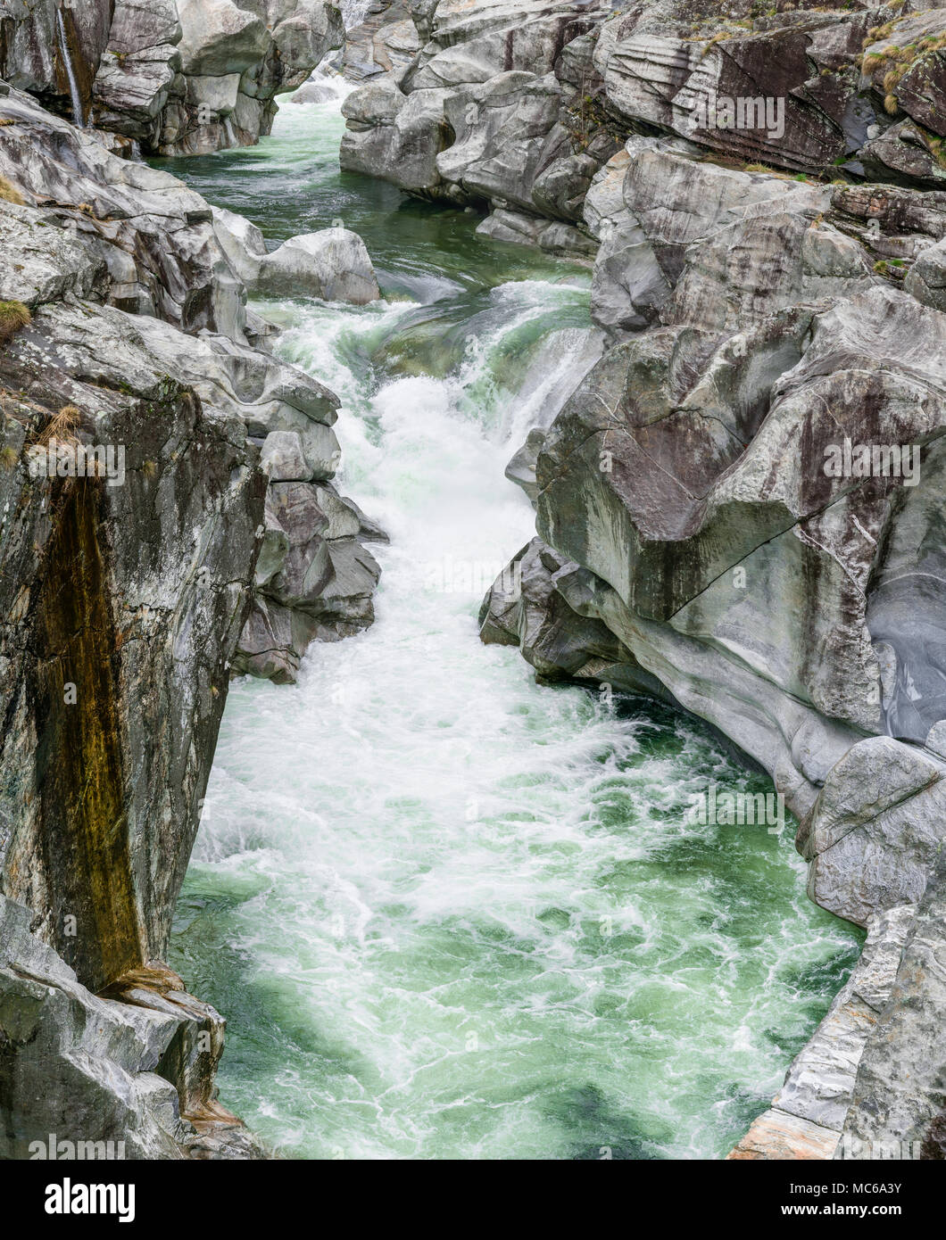 fantastic view of a mountain river carving ist way through a wild rocky ...