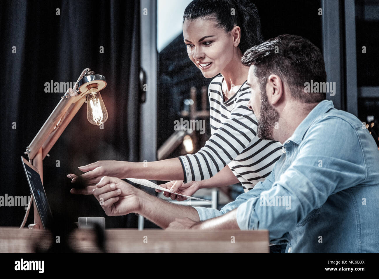 Interested friendly colleagues working and discussing the task Stock ...