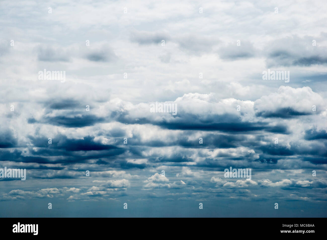 Multiple layers of ominous storm clouds Stock Photo - Alamy