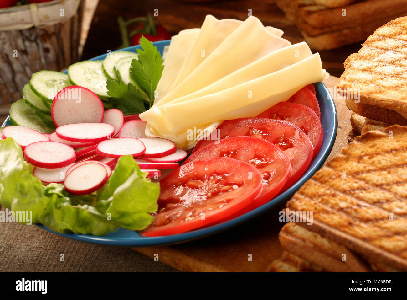Healthy breakfast of toast with yellow cheese and vegetables Stock ...