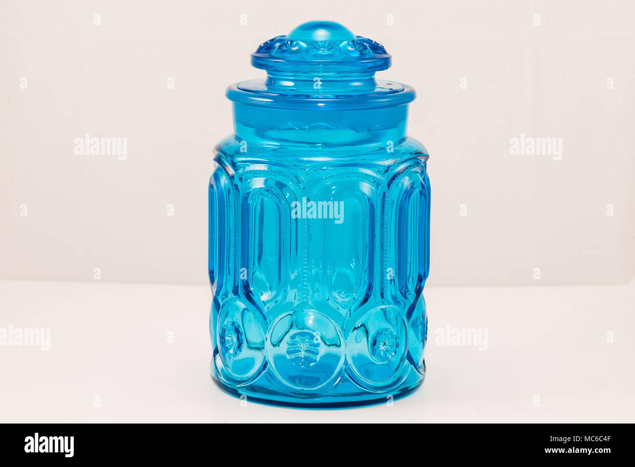 a large blue glass canister or cookie jar Stock Photo - Alamy